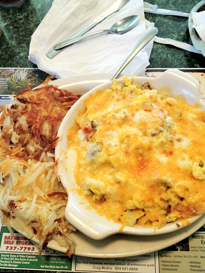 This cheesy masterpiece with crispy hashbrowns on the side isn't just breakfast&mdash;it's edible therapy that costs less than a session with your therapist.