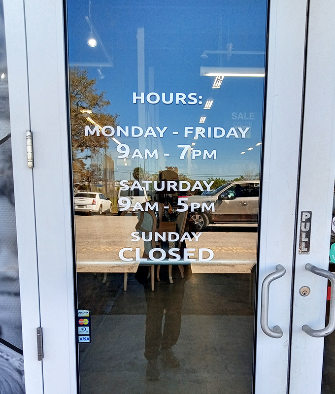 Business hours clearly posted, because knowing when to hunt for treasures is half the battle in the thrifting game.