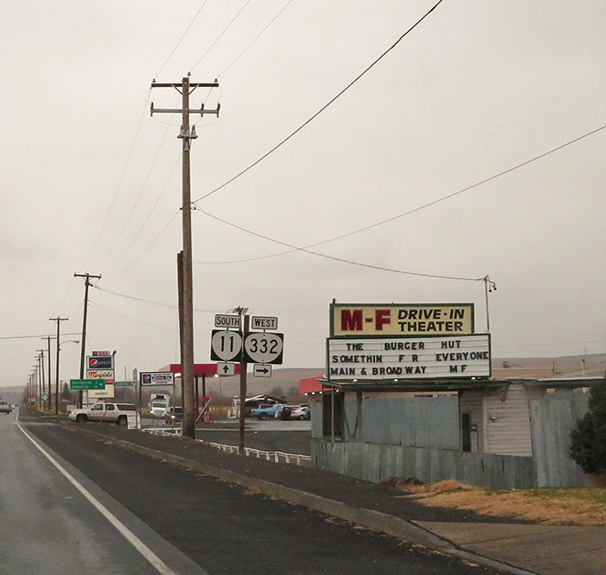Roadside Americana at its finest: where highway signs point to both physical destinations and evenings of escapist entertainment.