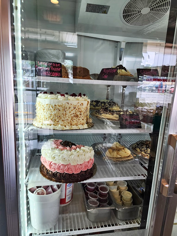 The dessert case: where willpower goes to die. These cakes aren't just baked—they're crafted with the kind of love that adds an extra inch to your waistline.