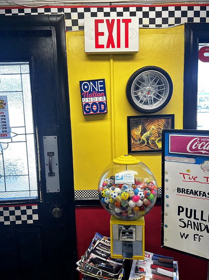Even the exit is charming! The classic checkered border, vintage decor, and gumball machine create that authentic diner atmosphere we all crave.