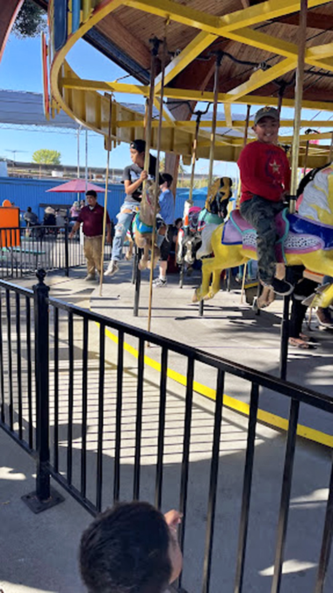 Round and round we go! This colorful carousel offers a moment of childhood joy for riders of all ages&mdash;nostalgia included at no extra charge.