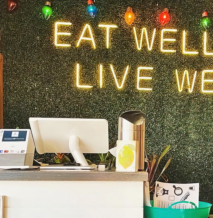 "Eat Well, Live Well" glows above the counter like the breakfast commandments handed down from the mount of morning deliciousness.