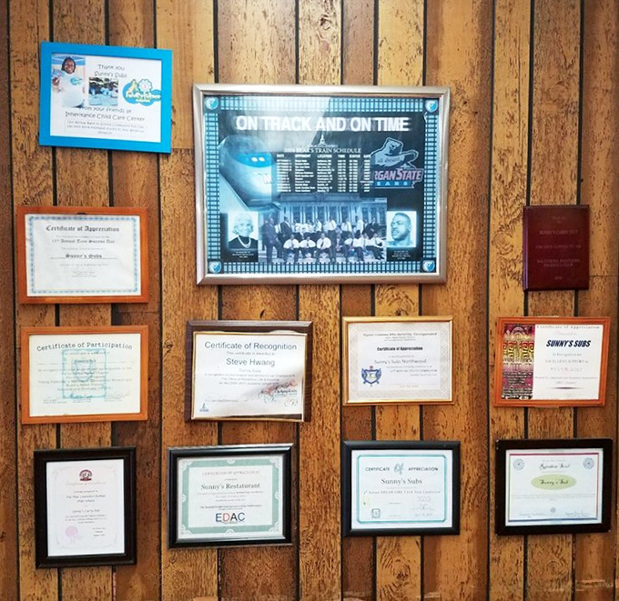 A wall of certificates and community recognition&mdash;the true measure of a beloved local eatery. These aren't Michelin stars, but they mean more.