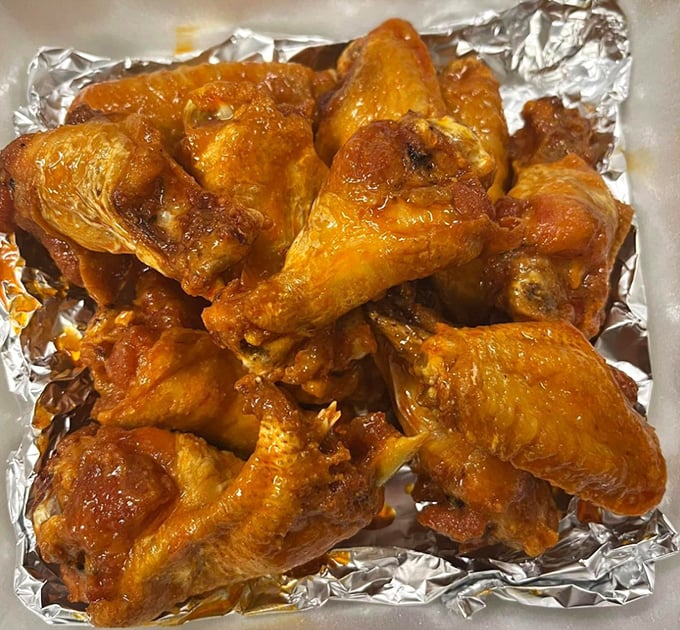 These wings aren't just cooked—they're transformed. Glistening with sauce and promising a flavor explosion that makes napkins necessary but optional.