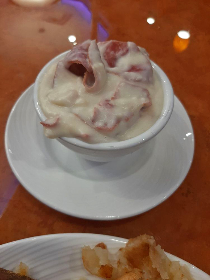 This isn't just ice cream—it's a swirled masterpiece of creamy indulgence. The ribbon of sauce creates a roadmap to happiness.