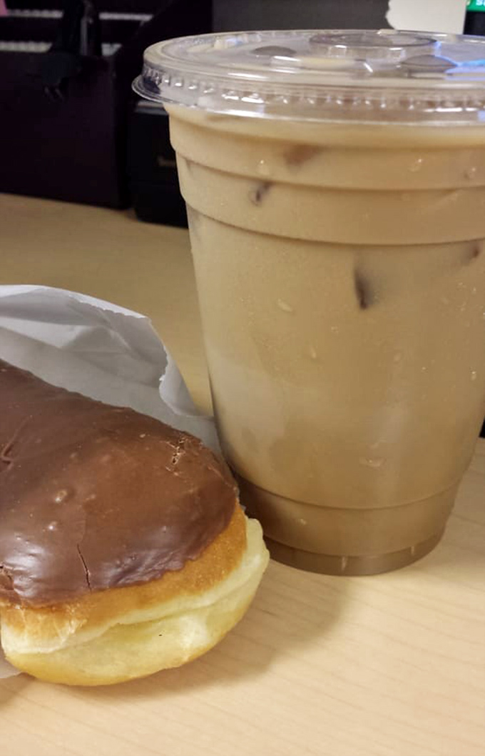 The classic pairing: a chocolate-glazed donut and iced coffee&mdash;partners in crime against morning grumpiness since forever.