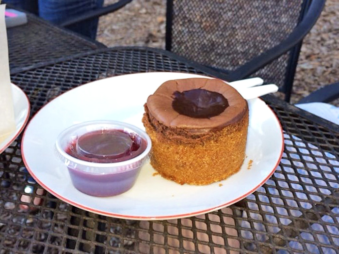 This chocolate creation isn't just dessert&mdash;it's therapy without the hourly rate. The little cup of berry sauce adds that perfect sweet-tart counterpoint.