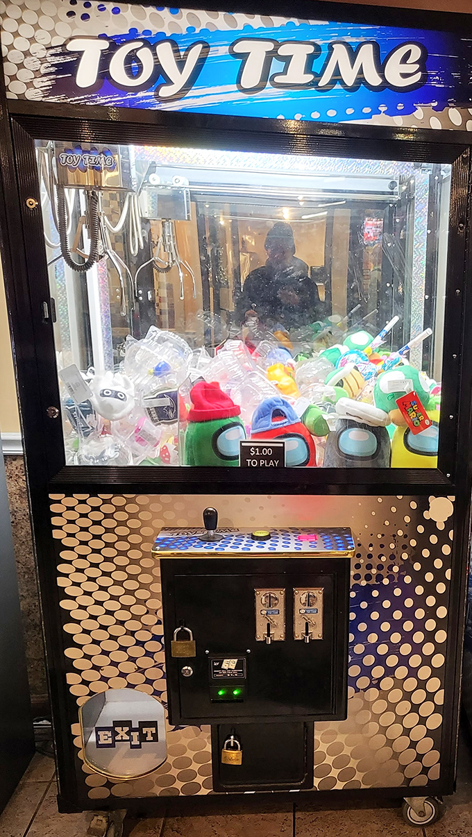 The claw machine—where kids develop gambling habits and parents develop negotiation skills about how many attempts are reasonable before leaving.