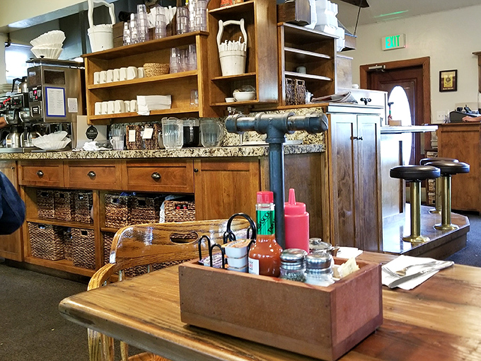 The condiment caddy&mdash;humble wooden vessel holding the essential breakfast accessories. Hot sauce diplomacy at its finest.
