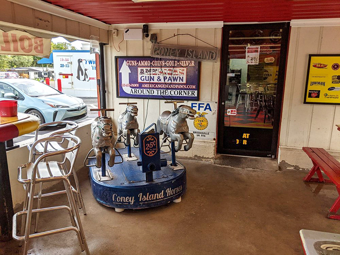 Not just any kiddie ride&mdash;a carousel of miniature horses that's probably carried generations of tiny diners. Quarter-powered nostalgia at its finest. 