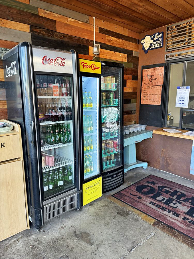 The drink coolers stand ready like loyal soldiers, prepared to extinguish the pleasant fire of perfectly spiced barbecue.