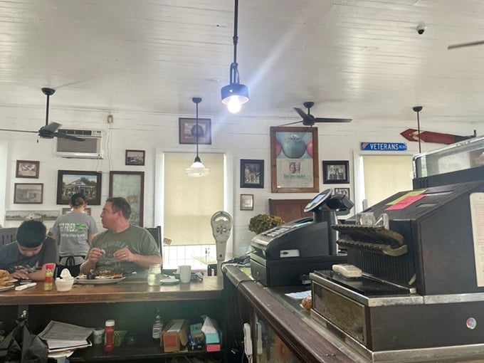 The counter where magic happens&mdash;simple ingredients transformed into legendary dishes while regulars perch on stools, trading tales.