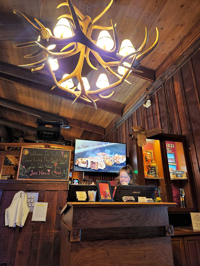 Beneath an antler chandelier that would make Gaston jealous, the host stand welcomes guests to what promises to be a memorable meal.