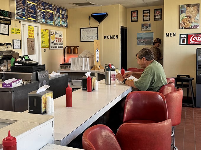 Solo dining at the counter&mdash;a Michigan tradition. That red squeeze bottle stands ready, like a loyal sidekick to your burger adventure.