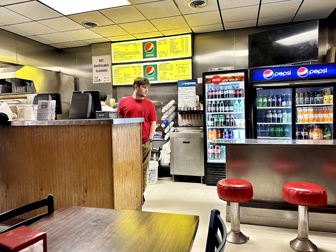 The counter where magic happens: orders taken, pizzas delivered, and the occasional life advice dispensed free of charge with every transaction.