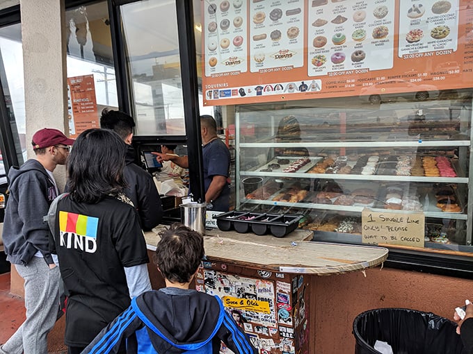 The pilgrimage ends here, at the counter where wishes are granted and diets are forgotten. Worth every minute in line.