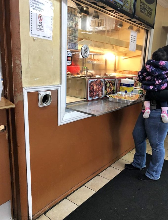The service counter where dreams come true and ordinary ingredients transform into extraordinary Caribbean culinary adventures.