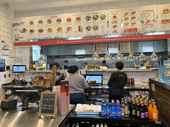 Where the magic happens. The open kitchen design lets you witness the choreographed dance of burger creation in real time.