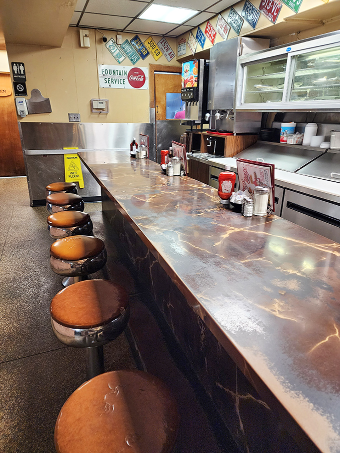 Counter seating: where solo diners become temporary members of the most democratic club in America.
