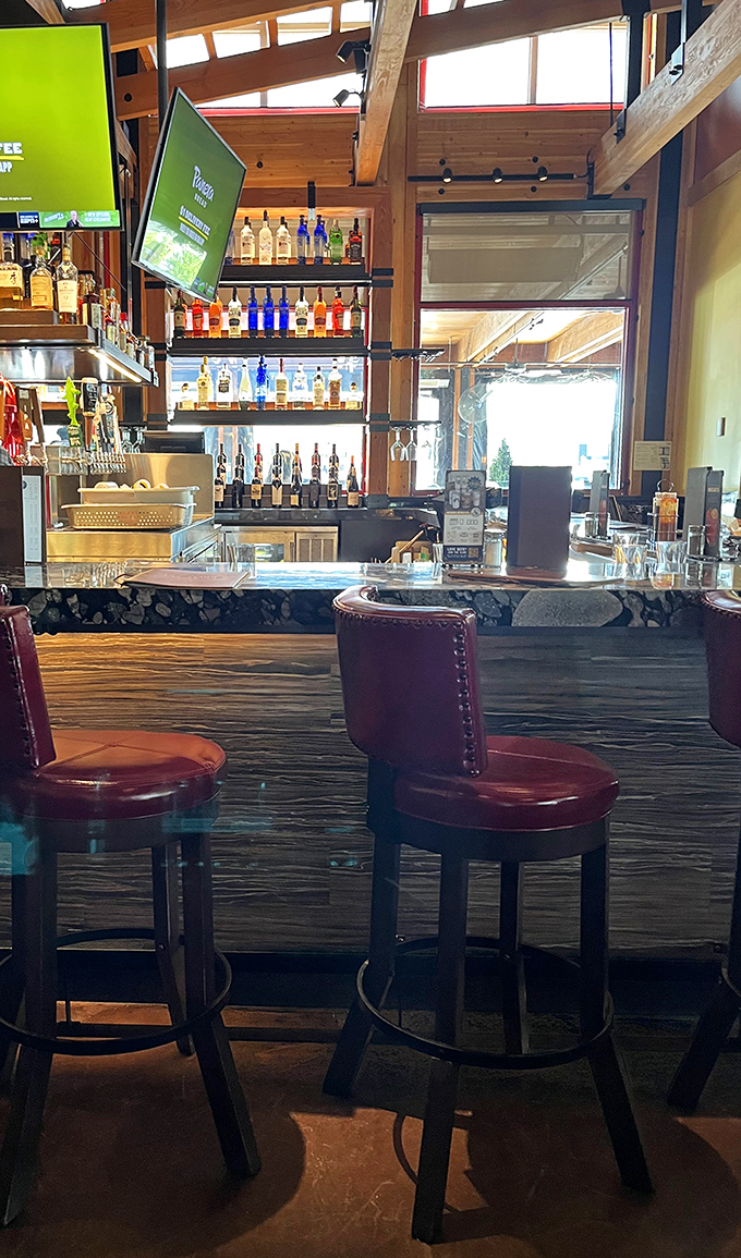 Bar seating with a view of the action. These leather stools invite you to perch, sip, and watch the cocktail choreography unfold.