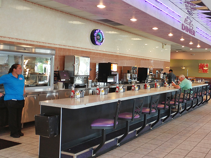 Counter culture at its finest—where regulars perch like birds on a wire, watching their breakfast materialize before their very eyes.