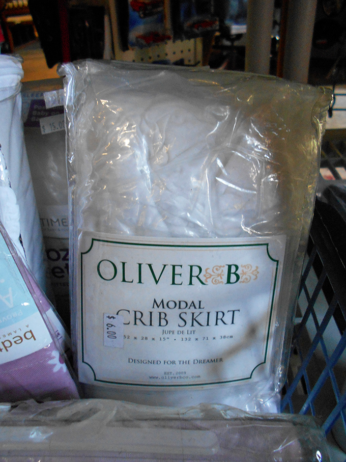 Still in its original packaging, this Oliver B crib skirt waits patiently for its chance to adorn a nursery with vintage charm.