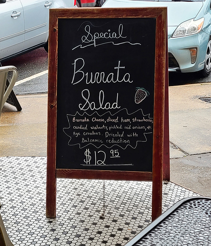 Chalkboard specials&mdash;like this tempting burrata salad&mdash;change with the seasons, showcasing the kitchen's creativity and commitment to fresh ingredients.