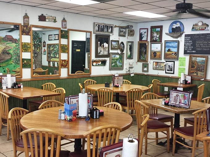 Wooden tables, country-themed artwork, and the promise of unhurried meals. This dining room feels more like a friend's kitchen than a restaurant.