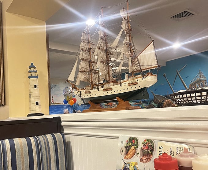 The model ship display reminds you that while the ocean is miles away, its bounty has safely docked on your plate.