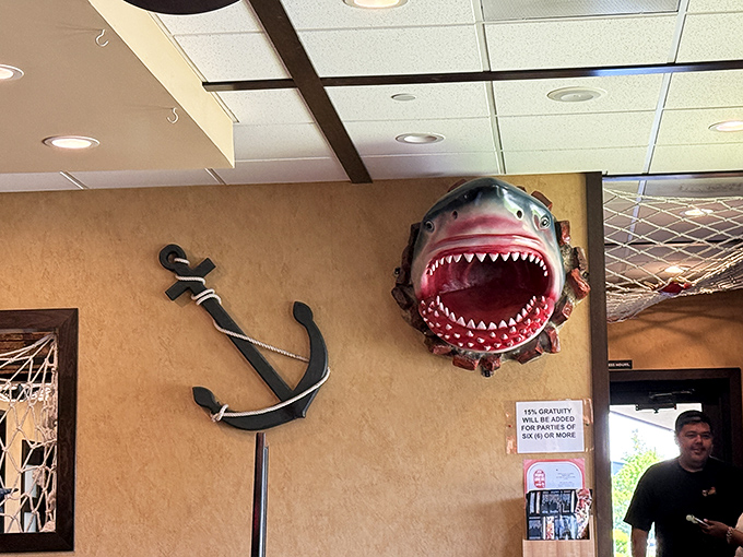 That shark bursting through the wall isn't subtle, but neither is the flavor bomb waiting in your seafood boil. Sometimes obvious is exactly right.