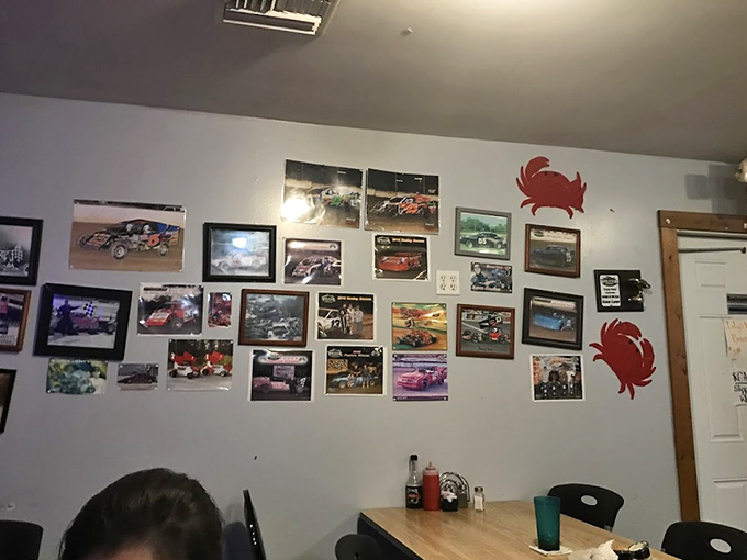 The wall of racing photos and crab decorations tells you everything &ndash; this is a place that celebrates local passions alongside seafood traditions.