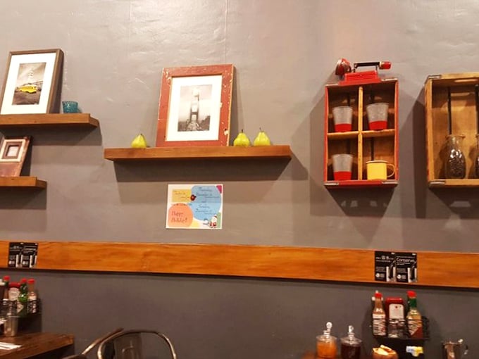Decorative shelves featuring Golden Gate Bridge photos and decorative pears &ndash; because even tiny restaurants deserve thoughtful touches that celebrate their city. 
