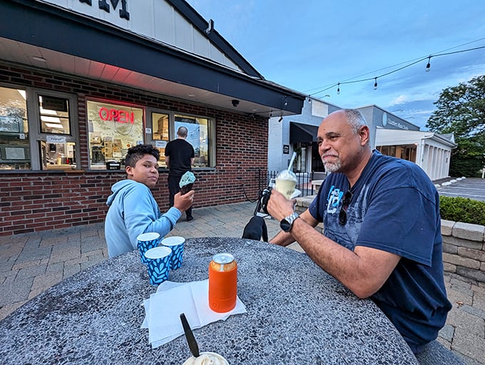 Multi-generational ice cream enjoyment&mdash;proof that the best family traditions involve dairy fat and sprinkles. Some lessons don't need words.
