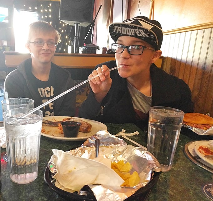 The universal expression of pizza satisfaction knows no age limit. That straw-sipping moment when you're already planning your next visit.