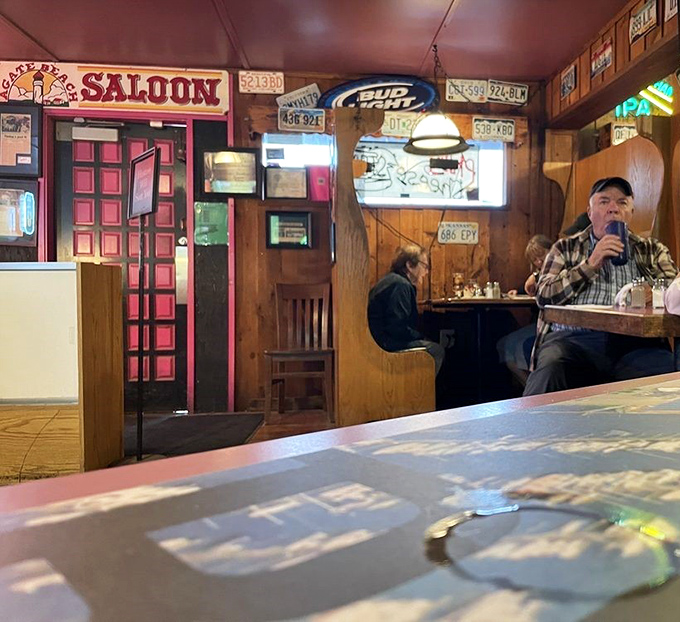 The saloon area offers the perfect blend of privacy and community&mdash;where strangers become friends over shared appetizers.