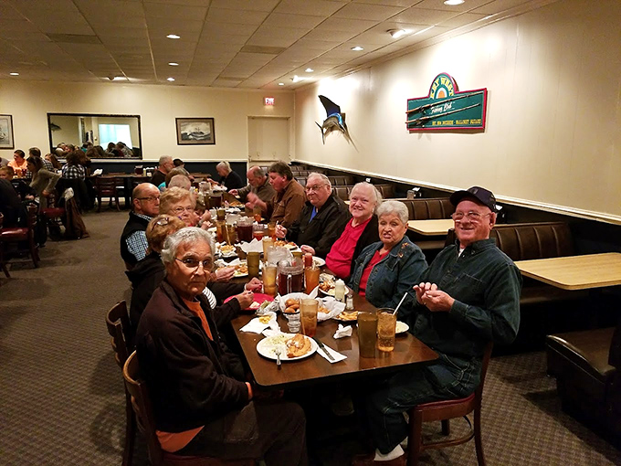 The happiest table in Fayetteville, where strangers become friends over shared hushpuppies and fish tales.