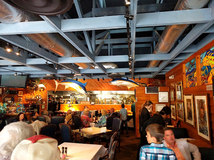 The exposed beams and bustling dining room create the perfect backdrop for family gatherings. Good food brings good people together.