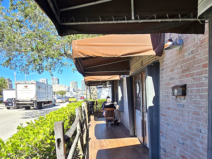 The covered porch&mdash;where the aroma of smoke meets fresh air, and patience is rewarded with the promise of imminent barbecue bliss.
