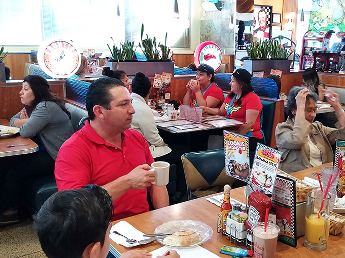 A dining room filled with the universal language of "mmm" and "pass the syrup," where strangers become neighbors over coffee refills.
