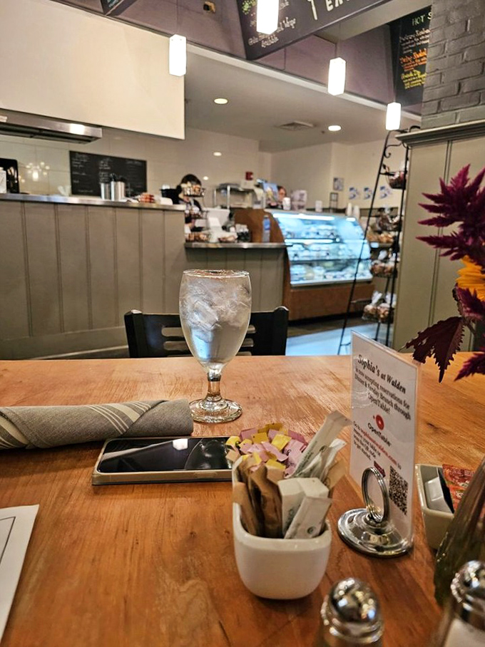 A perfectly set table awaits its guests &ndash; water glass filled, napkin folded, and the promise of good things to come.