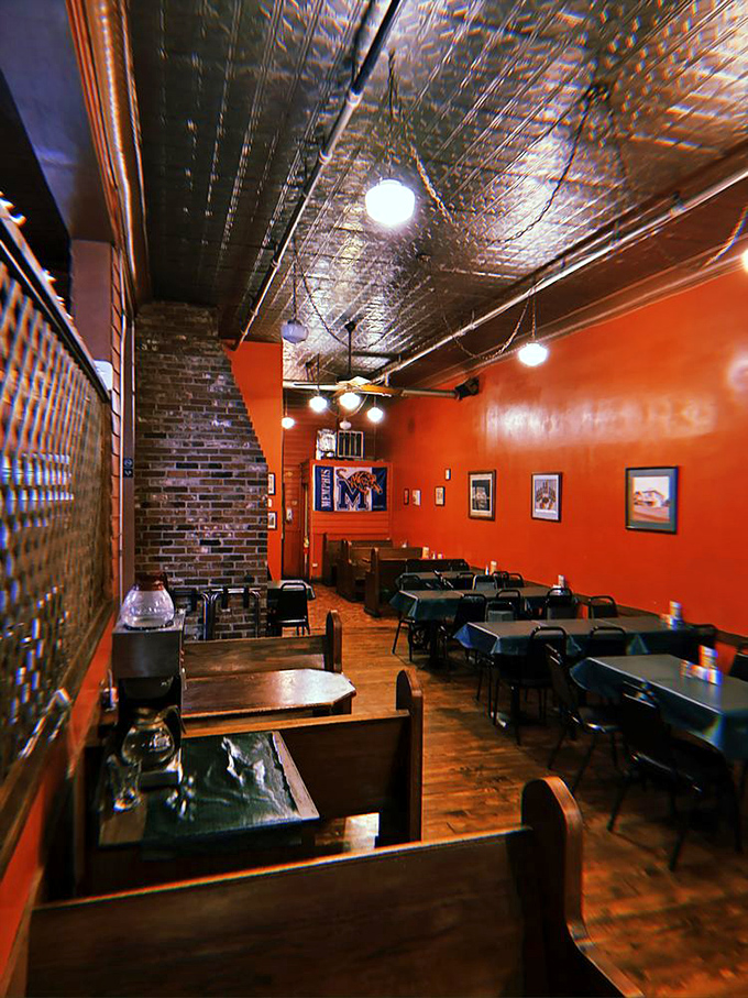 Simple tables, brick walls, and that signature orange-red color create a no-nonsense dining room where the food rightfully takes center stage.
