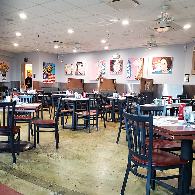 A dining room that balances comfort with cool. Pop art watches over patrons as they dive into plates of morning deliciousness.
