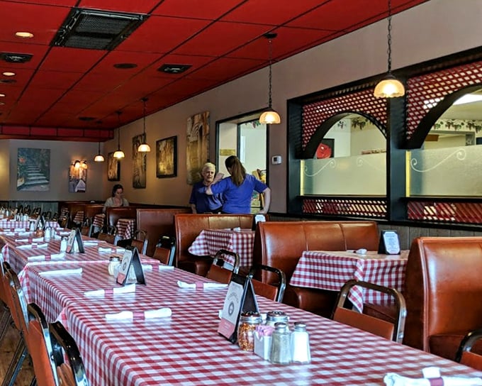 Red checkered tablecloths and leather booths—the universal signal that you're about to eat something that will require an extra notch on your belt.