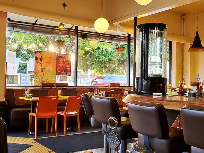 Sunlight streams through windows illuminating a space where mid-century design meets modern California casual in perfect harmony.
