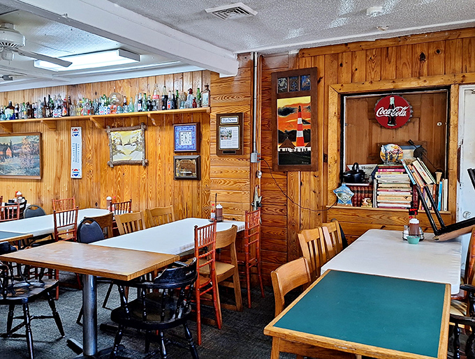 The dining room feels like your favorite uncle's den, if your uncle happened to be an exceptional Southern cook with a penchant for wood paneling.