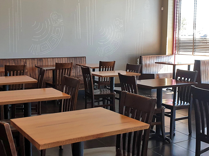 Clean lines, wooden accents, and thoughtful spacing make dining in feel like a respite from the world outside. Minimalism with maximum comfort.