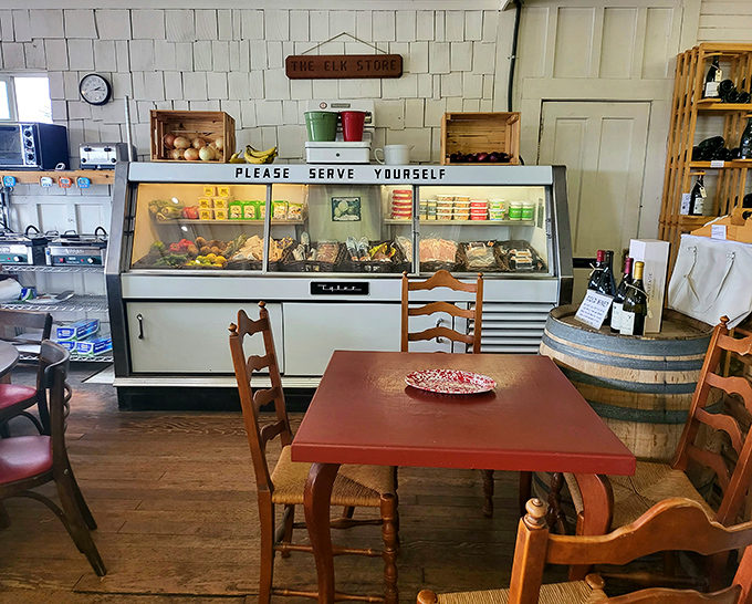 The "Please Serve Yourself" sign above the deli case&mdash;an invitation to culinary adventure in a room where time slows down.