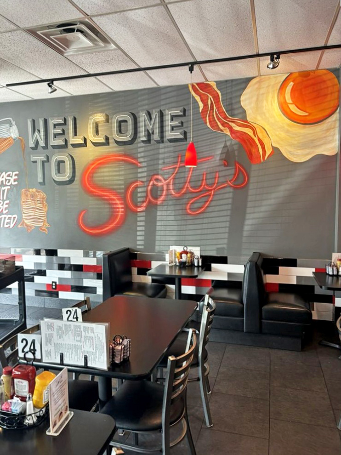 Modern diner aesthetics meet old-school hospitality. The black, white, and red color scheme creates a space that's both timeless and welcoming.