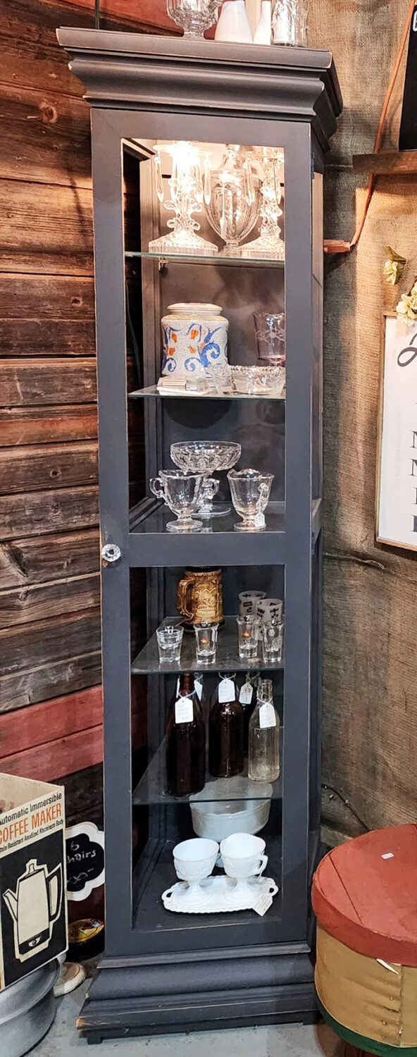 Display cabinets showcase curated collections, turning everyday objects into museum-worthy exhibits of American life and culture.